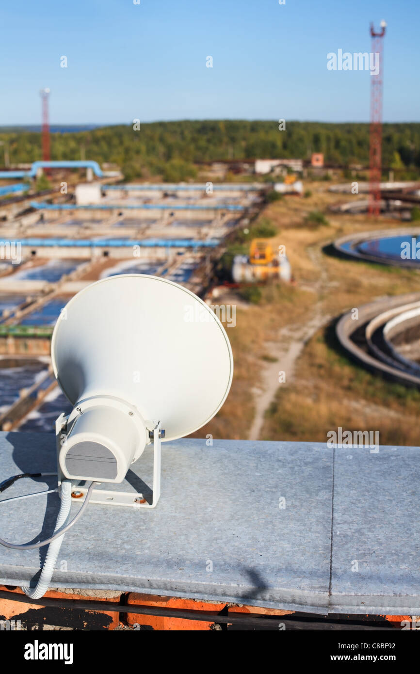 Warning system megaphone on the roof of industrial building in factory ...