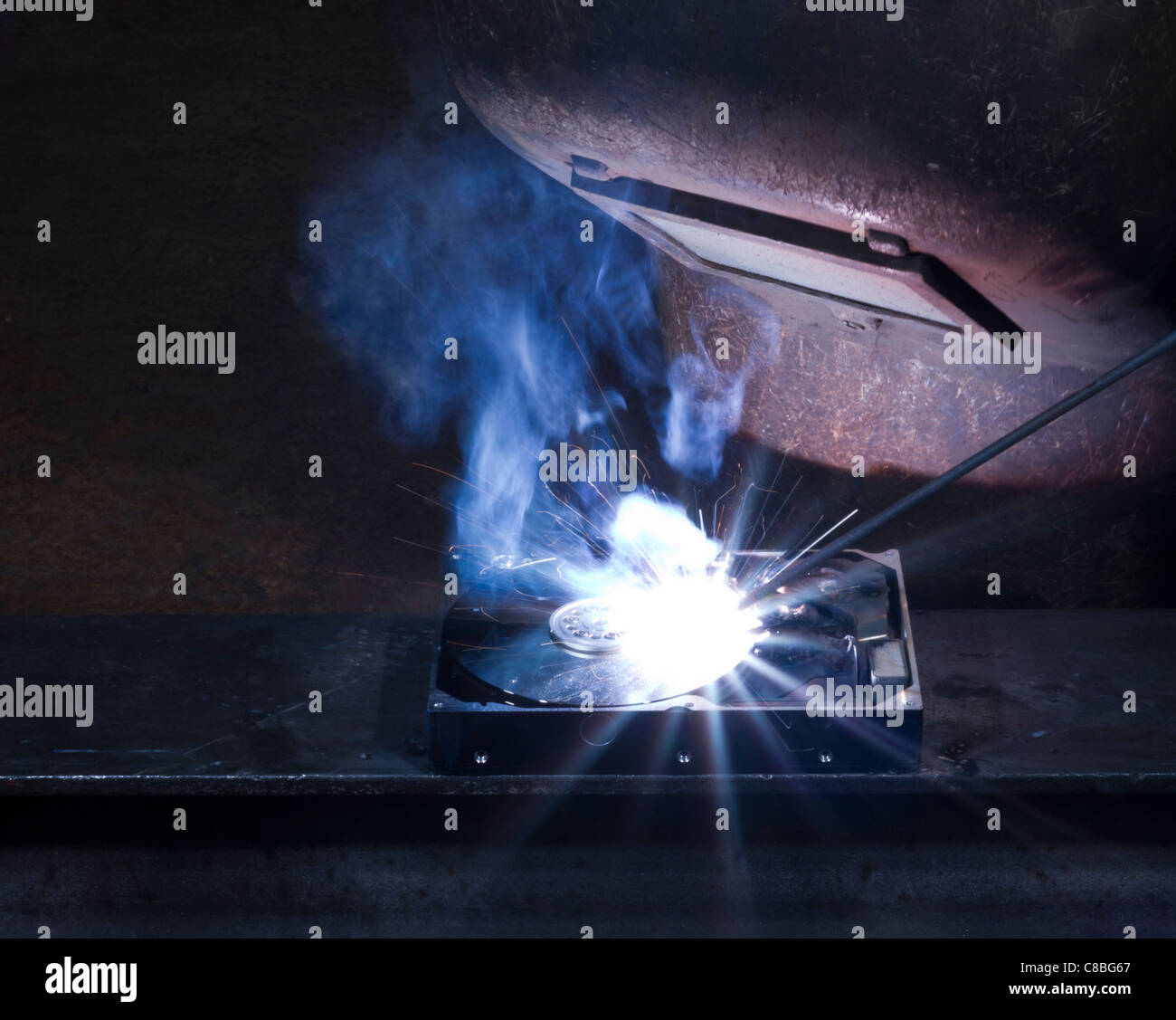 welding scenery with hard disk drive, welding mask detail and flashy ...
