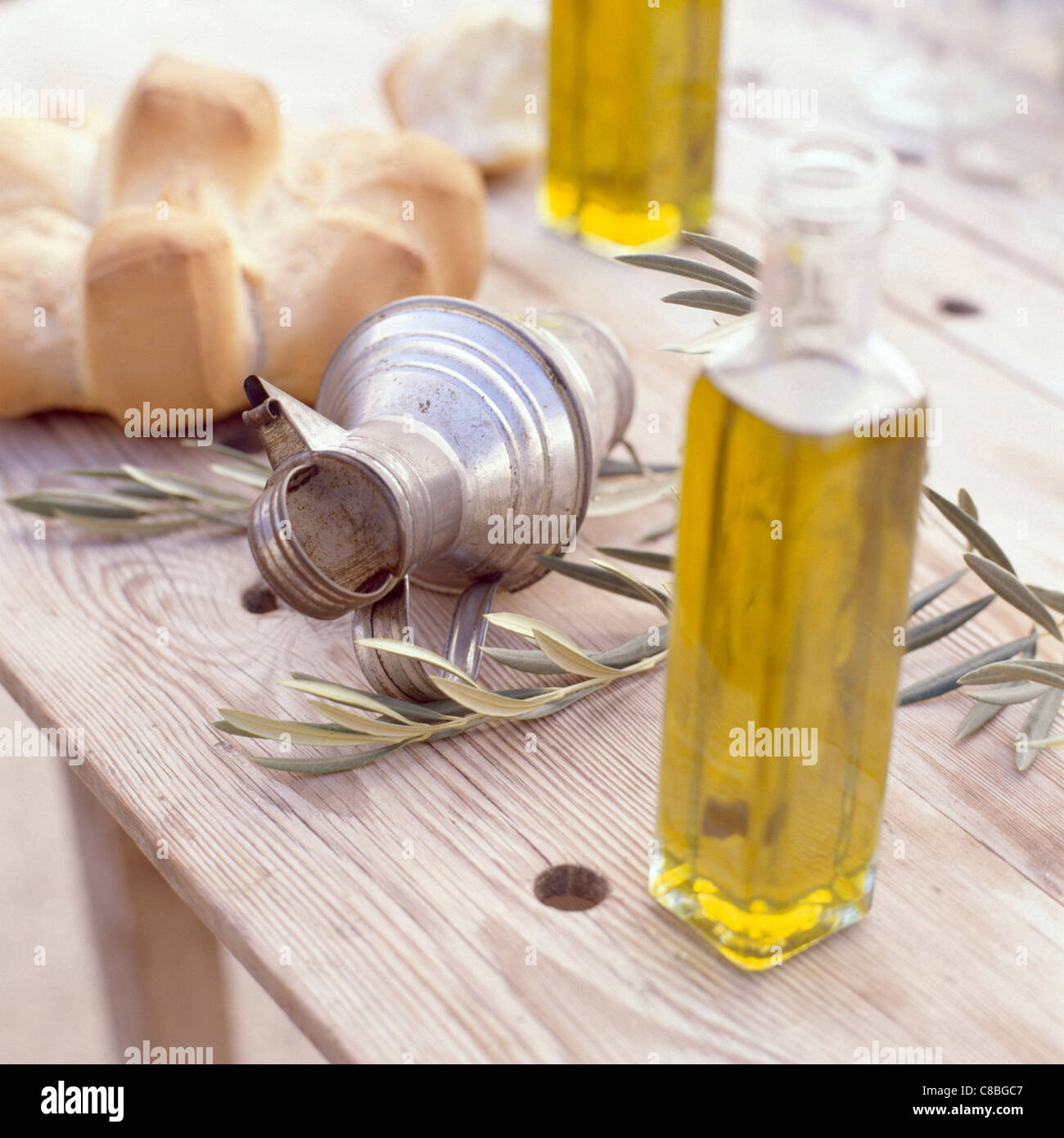 olive oil, bread, pouring can and bottles Stock Photo - Alamy