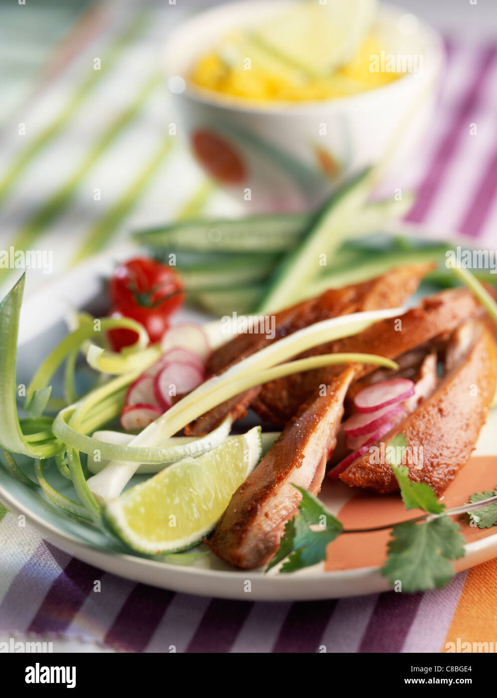 slivers of spicy chicken with lime and scallions Stock Photo - Alamy