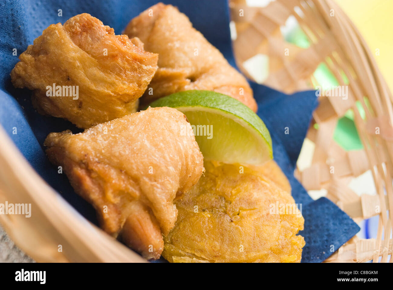 Fried chicken (cracklings) with fried plantains Stock Photo - Alamy