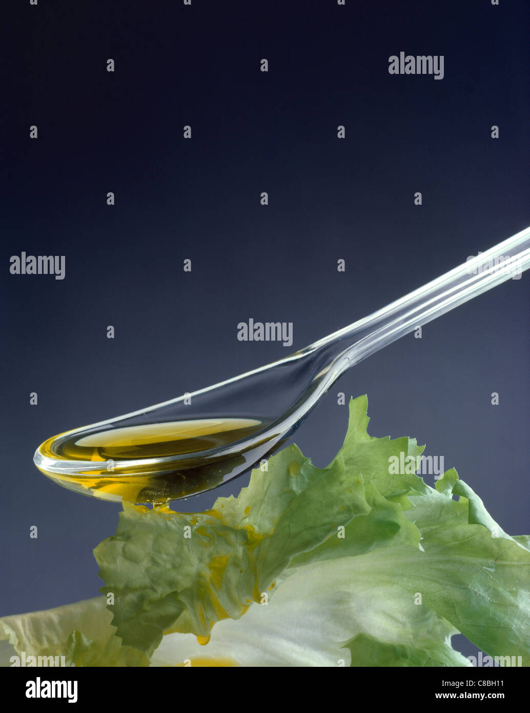 lettuce leaf and spoonful of oil Stock Photo - Alamy
