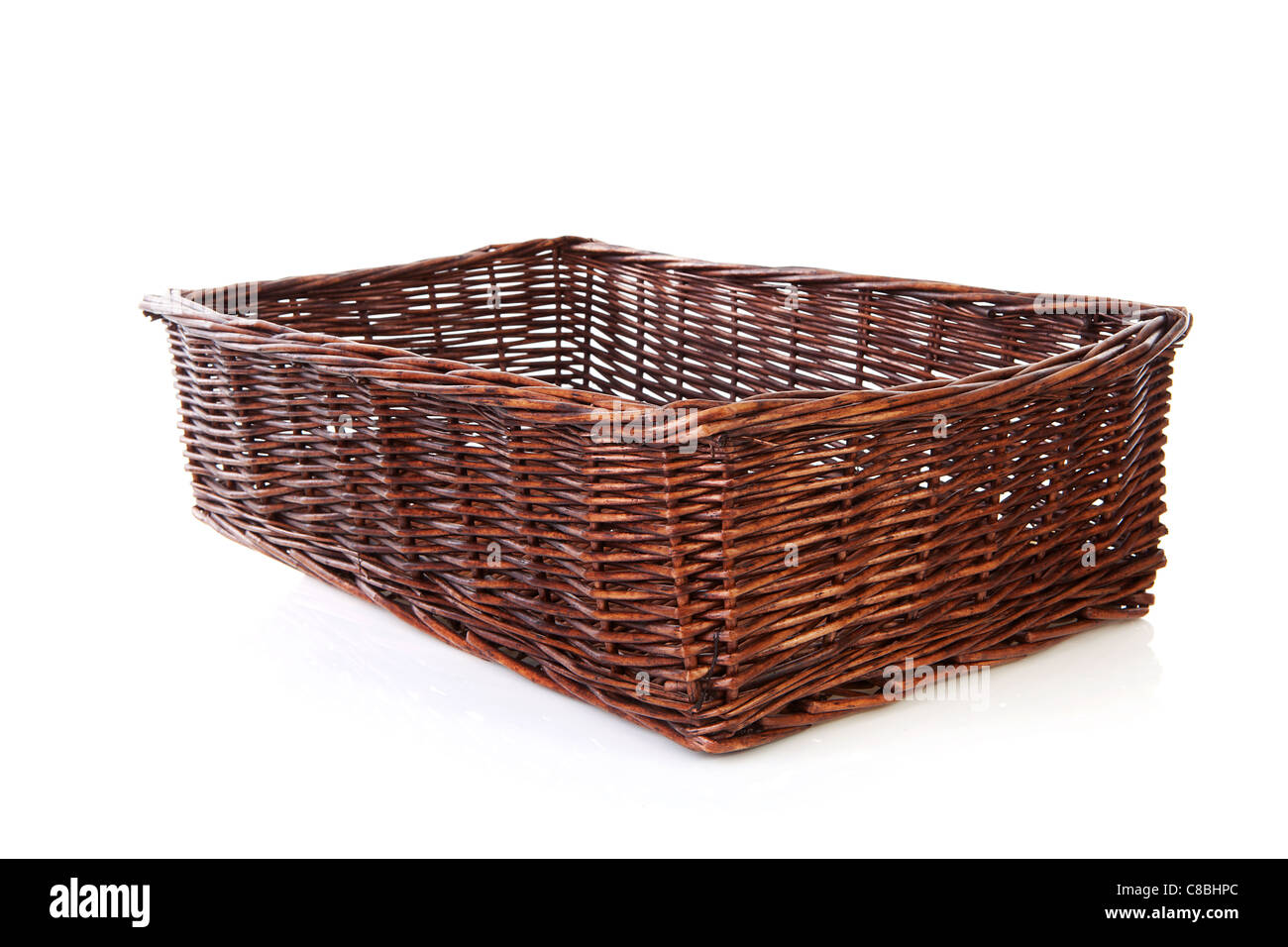 Big empty cane basket over white background Stock Photo - Alamy