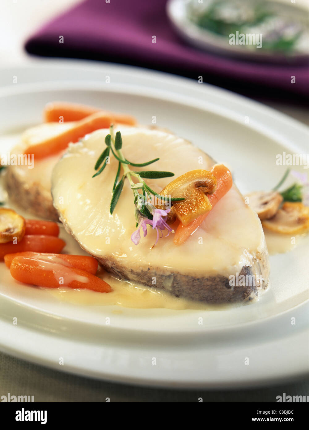 hake steak in sauce Stock Photo - Alamy