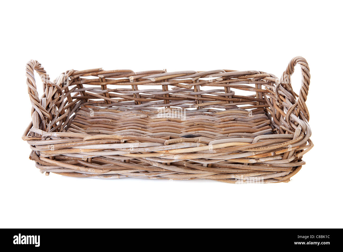 Big empty cane basket over white background Stock Photo - Alamy
