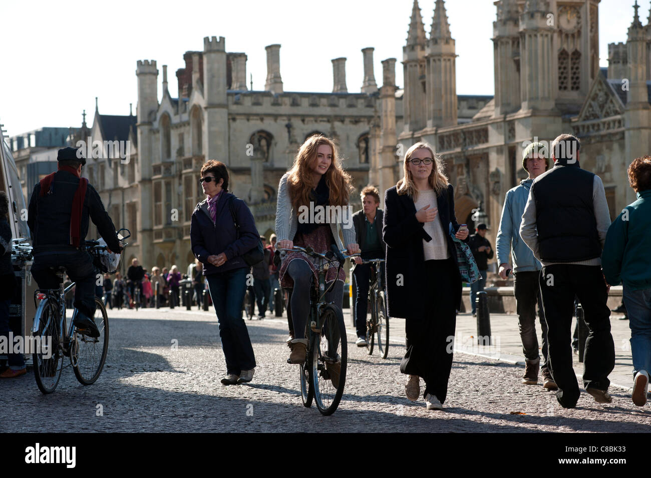 Cambridge University students cycle past Kings College, Cambridge ...