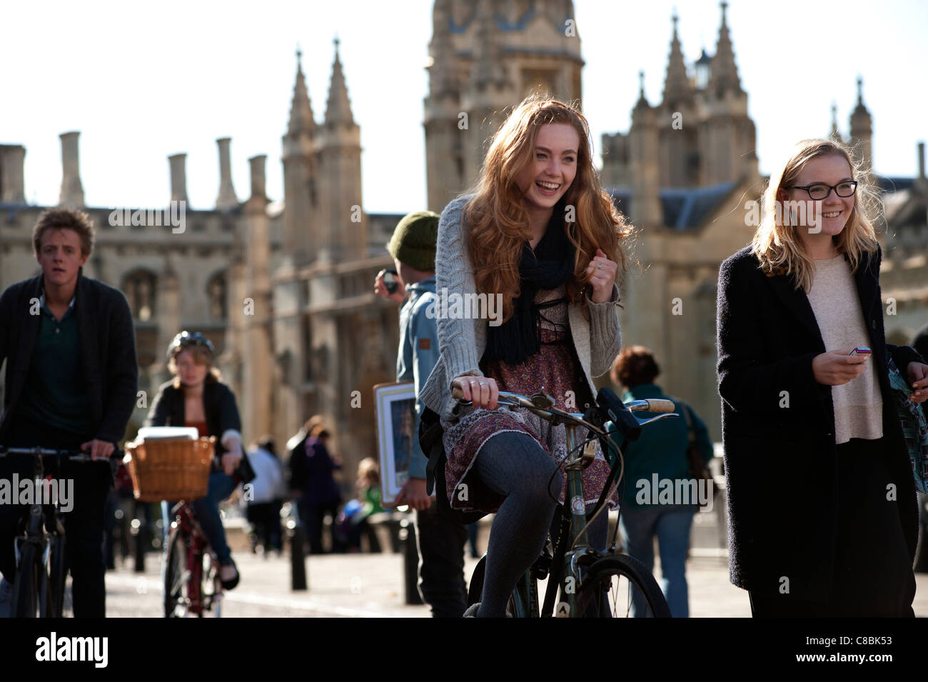 Cambridge University students cycle past Kings College, Cambridge ...