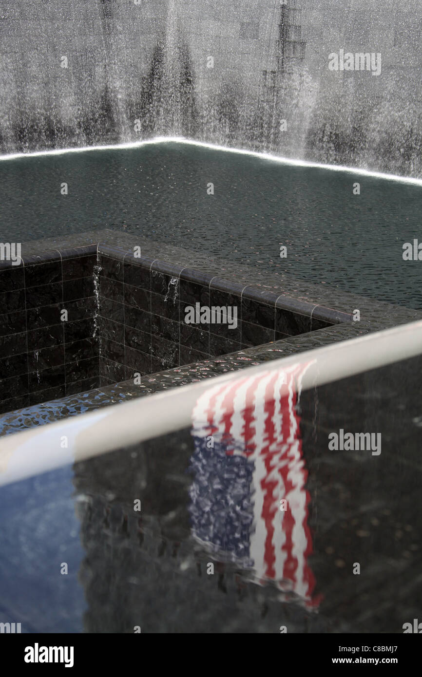 American Flag reflecting in a pool at the National September 11 ...