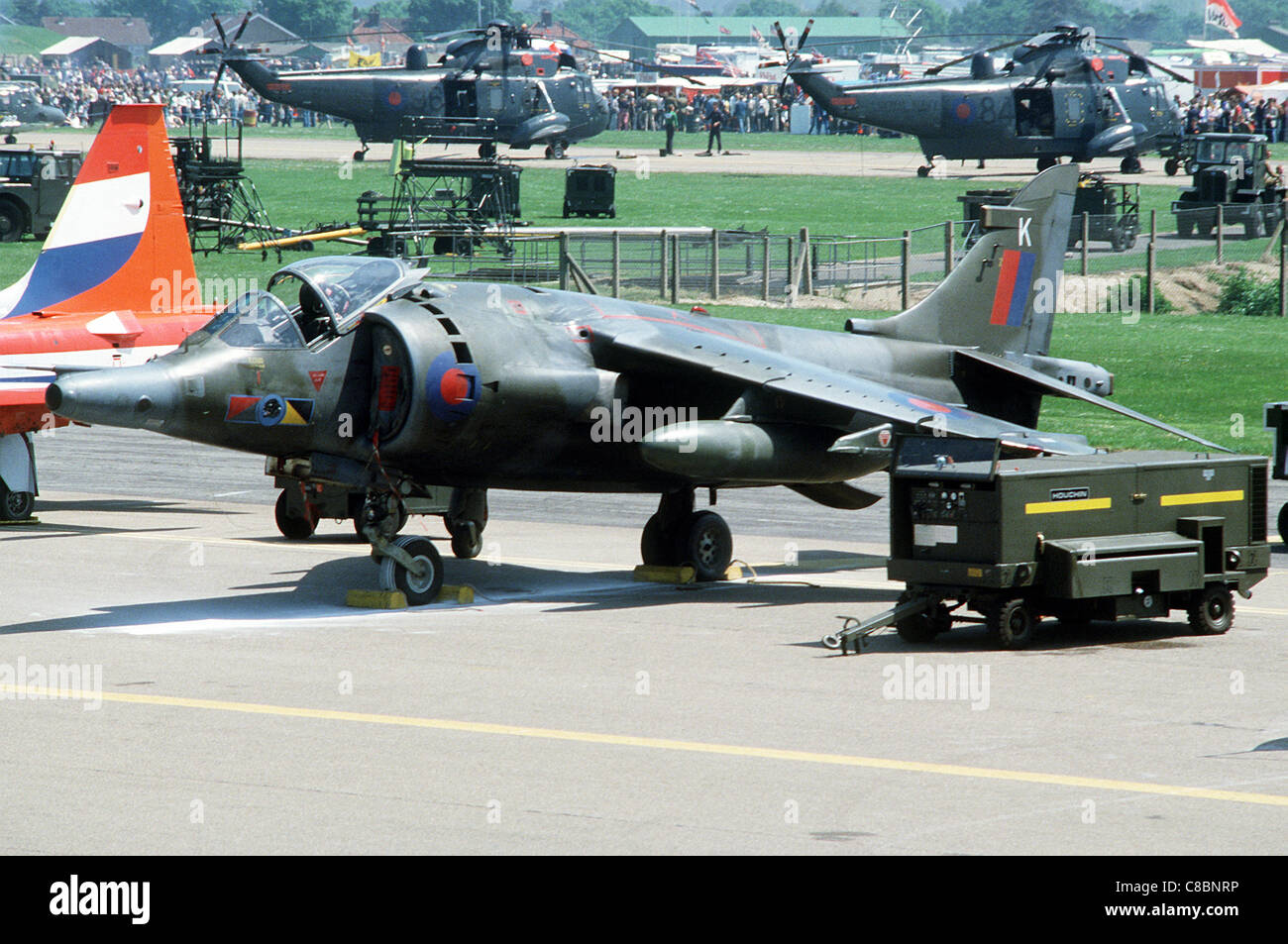 A Royal Air Force Harrier GR. Mark 3 aircraft parked on the flight line ...