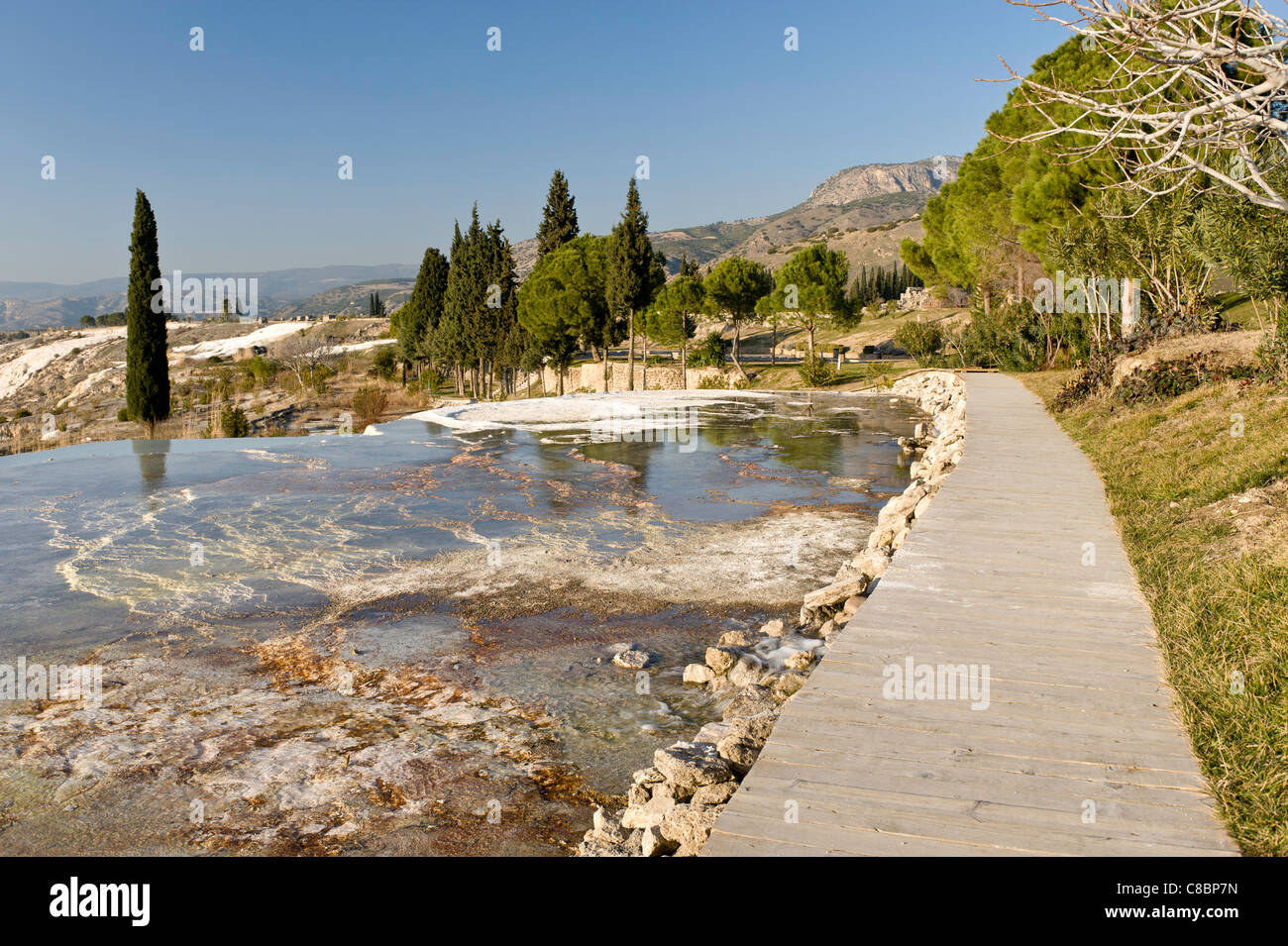 The boardwalk at the summit of the travertines in Pamukkale, Denizli ...