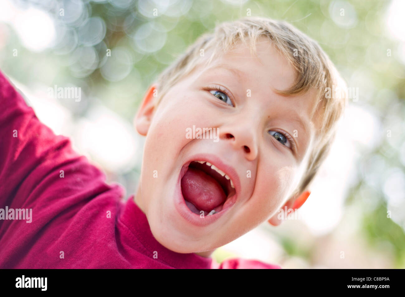 A 5-year-old boy makes a face while playing outside Stock Photo - Alamy