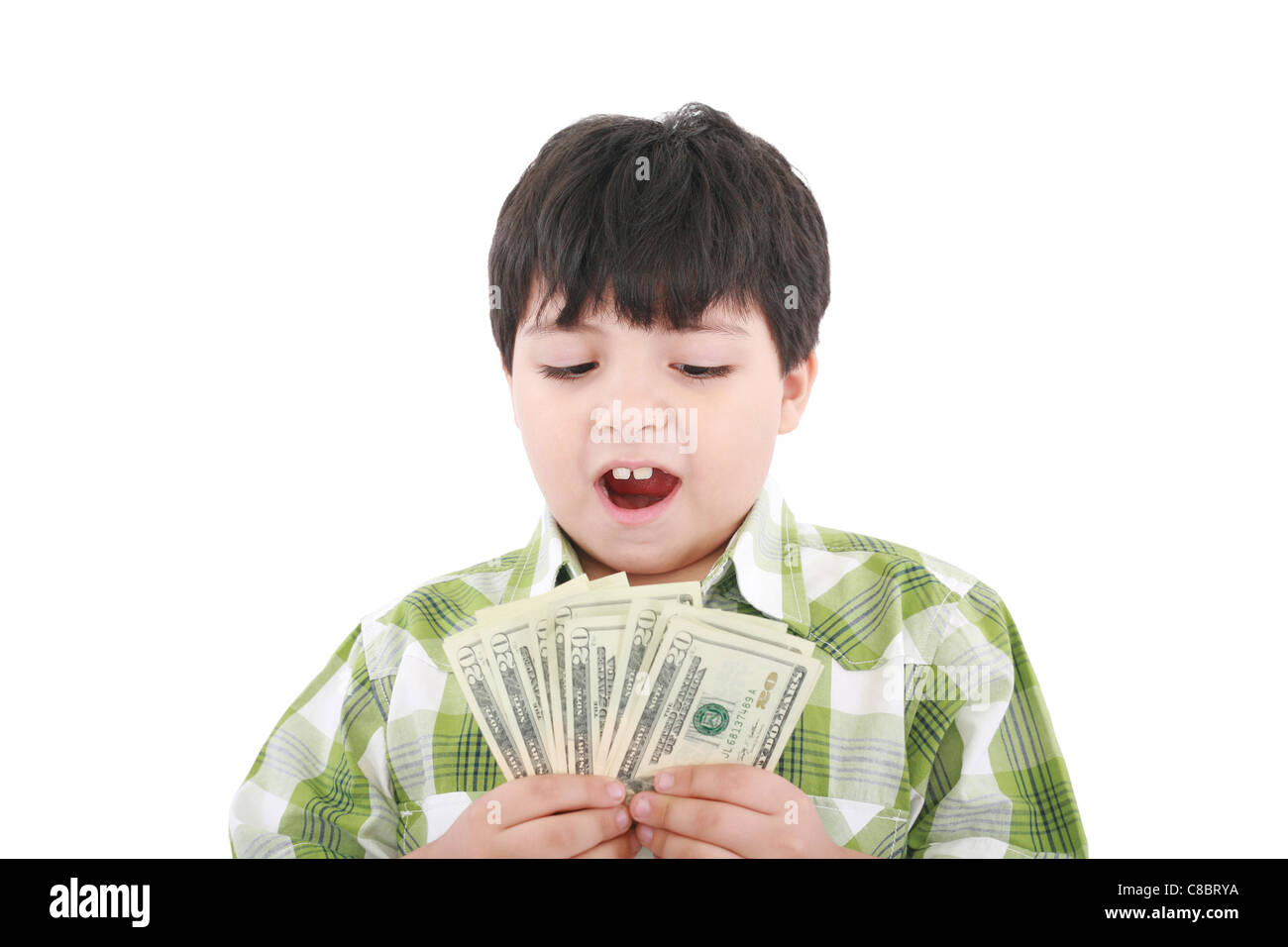 A smiling little boy is counting money - on white background Stock ...