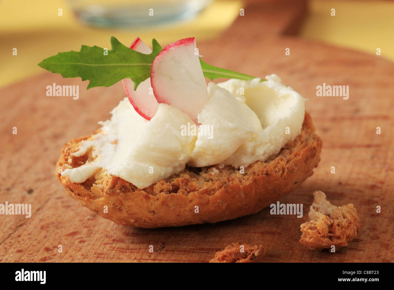 Crispy roll and cheese spread - closeup Stock Photo - Alamy