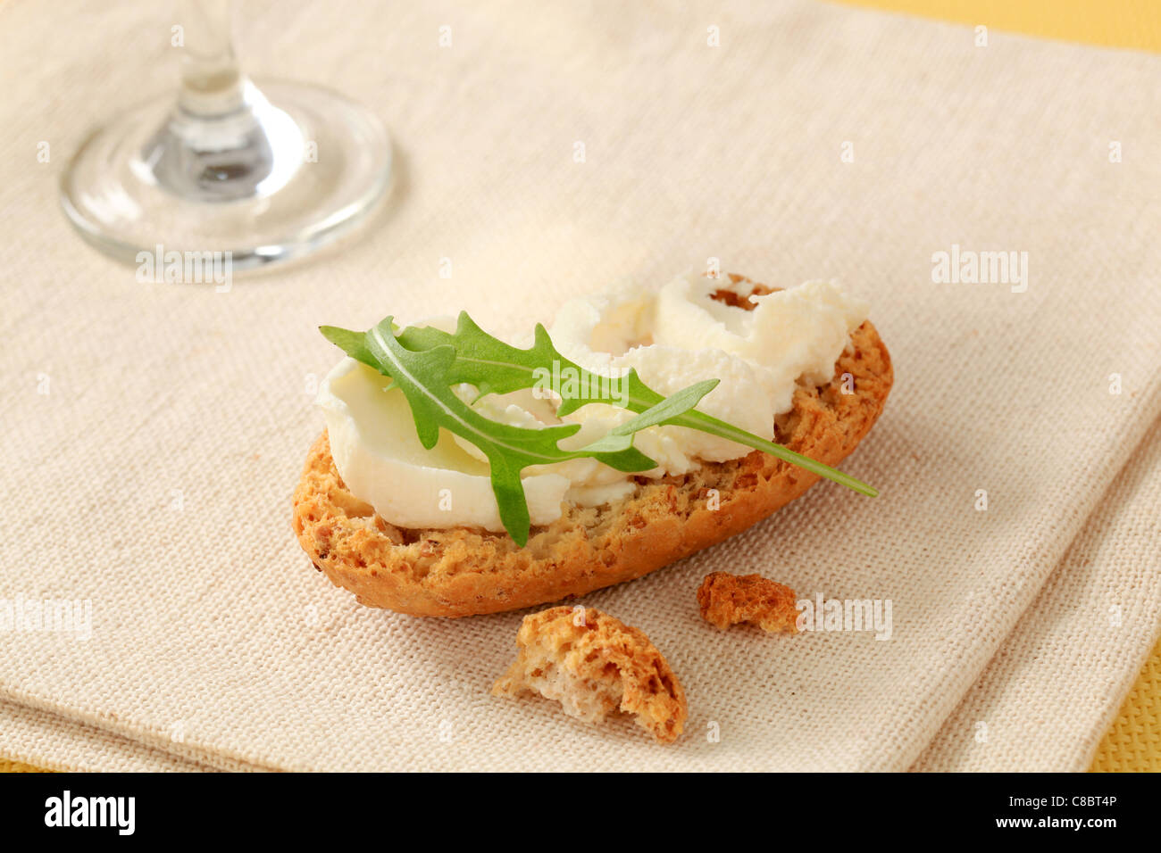 Crispy roll and cheese spread - closeup Stock Photo - Alamy