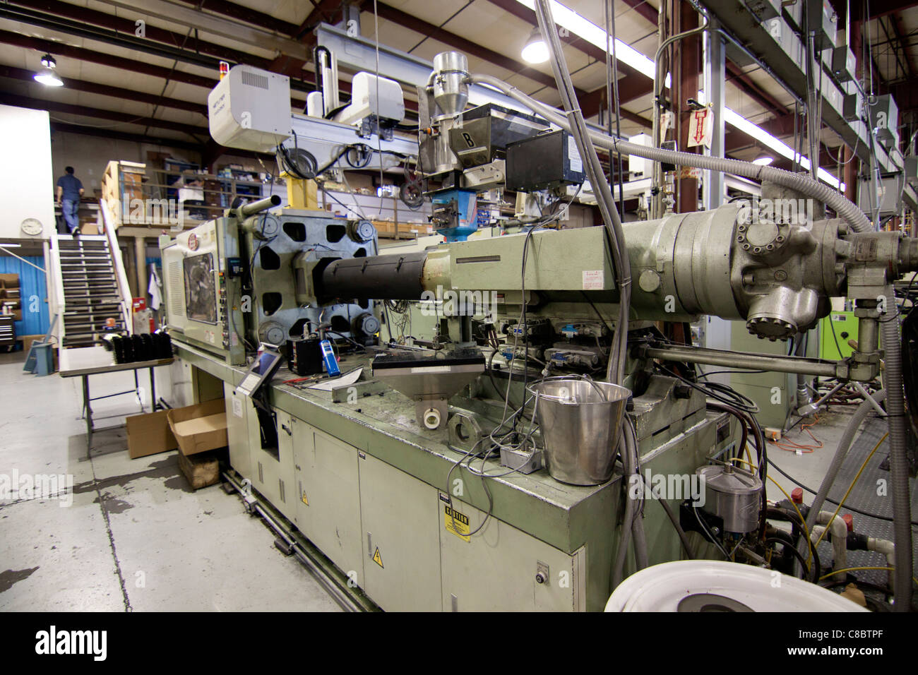 A plastics molding injection machine in Hudson, Colorado, USA Stock ...