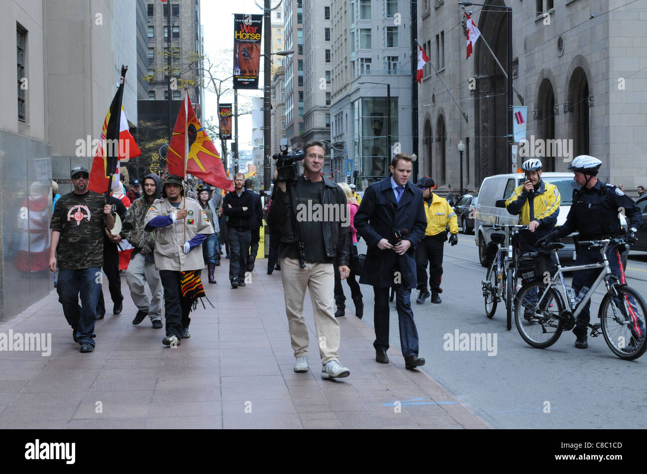 The Occupy Toronto protest movement, unidentified marchers, media and ...