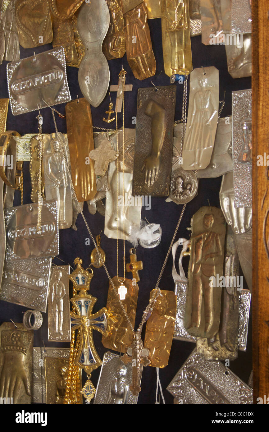 Collection of milagros in a Catholic church Stock Photo - Alamy