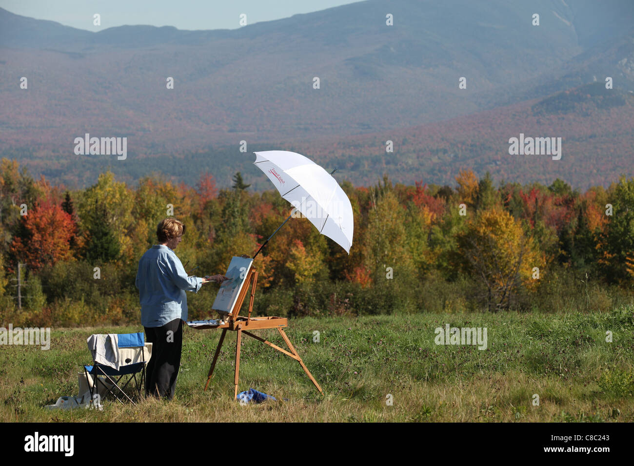 Local female artist painting fall foliage in Sugar Hill, New Hampshire ...