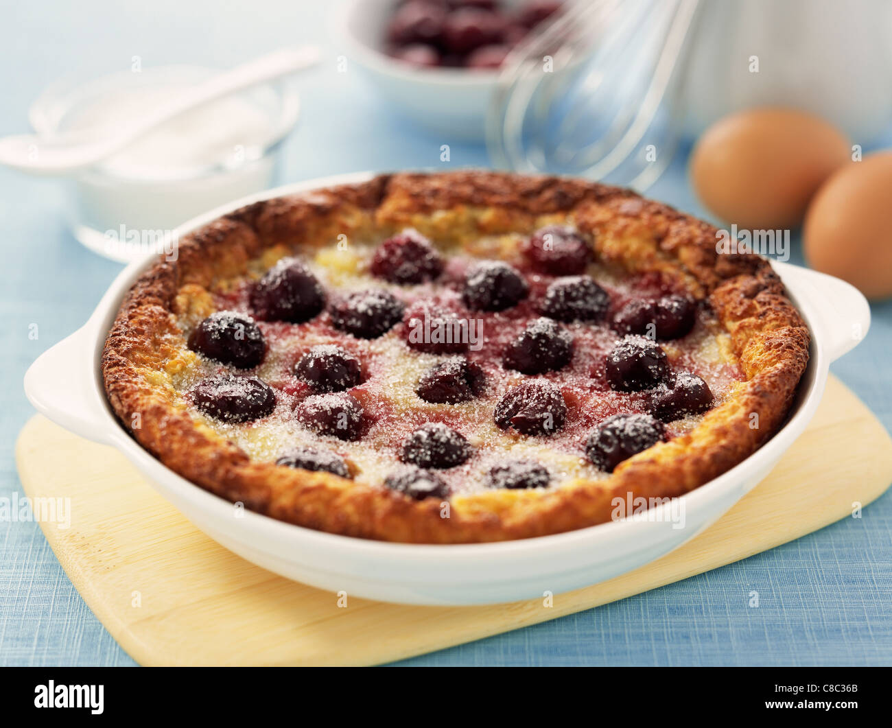 cherry clafoutis batter pudding Stock Photo - Alamy