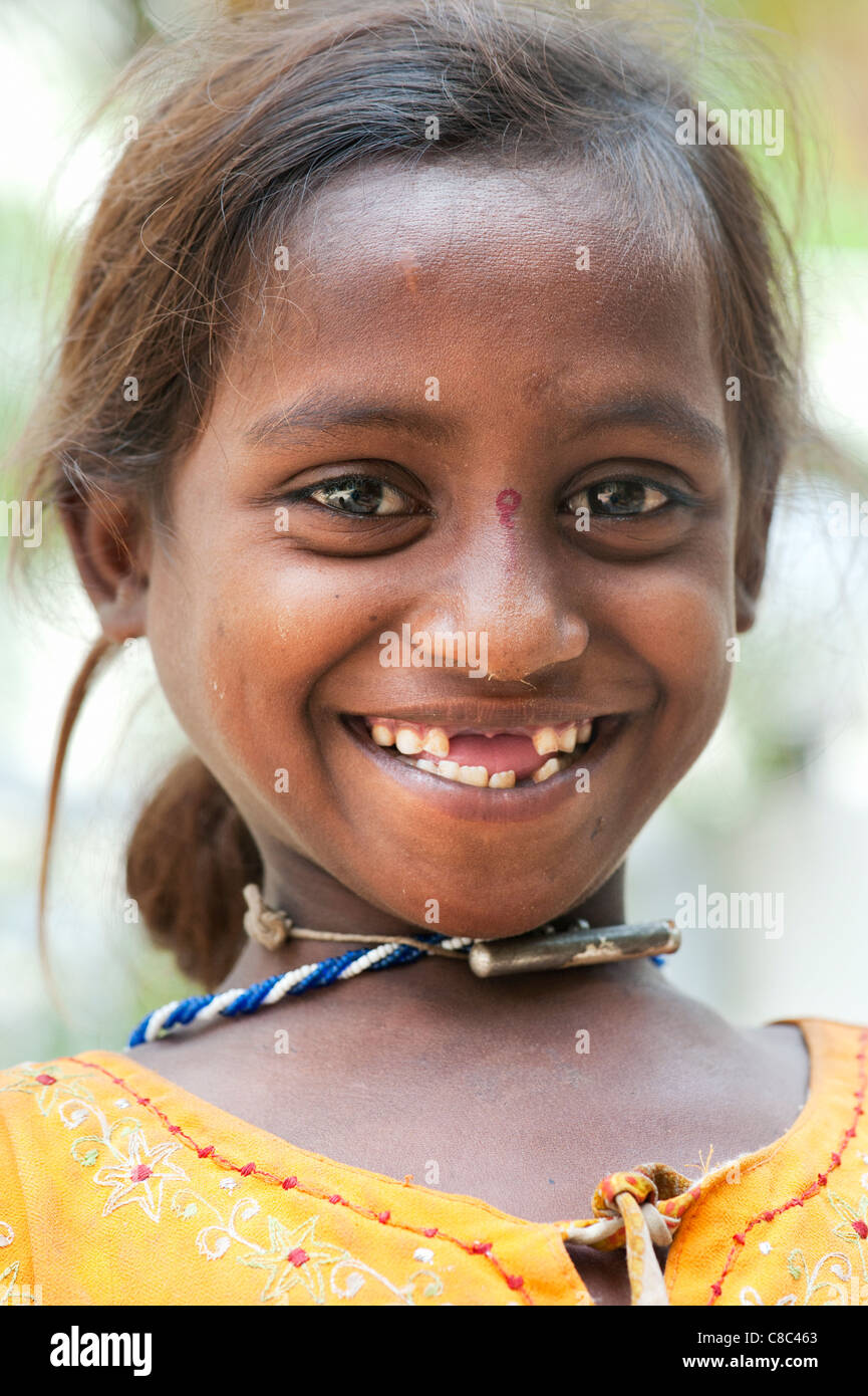 Happy young poor lower caste Indian street girl smiling with missing ...