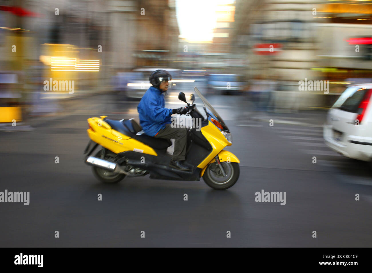 A scooter rider in Rome, Italy Stock Photo - Alamy