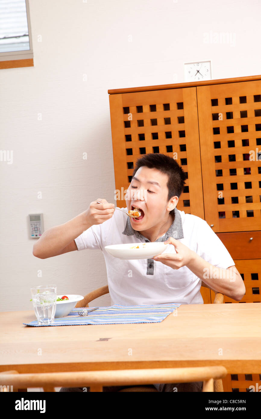 Man eating curry hi-res stock photography and images - Alamy