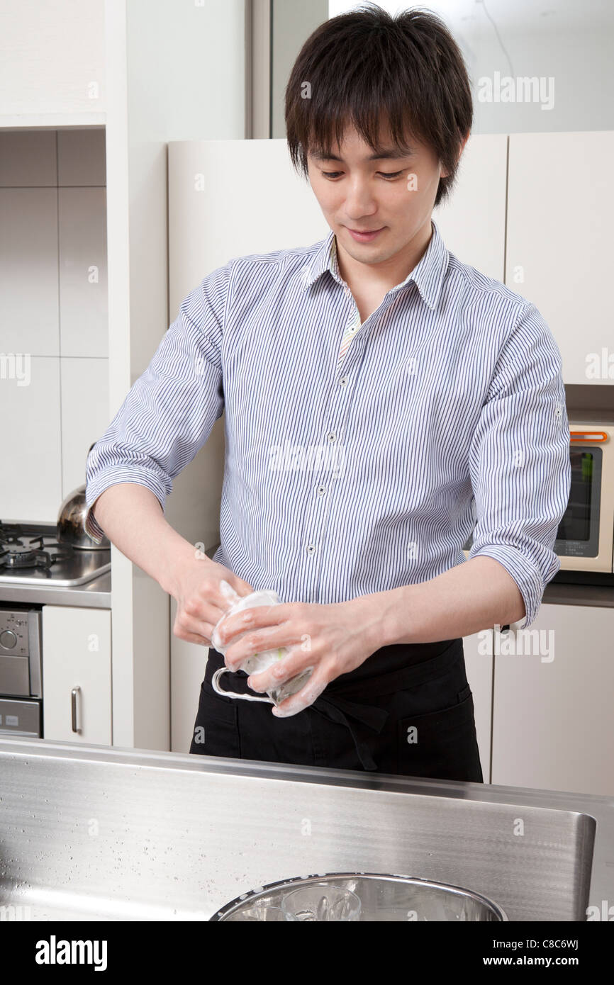Young black washing up hi-res stock photography and images - Alamy
