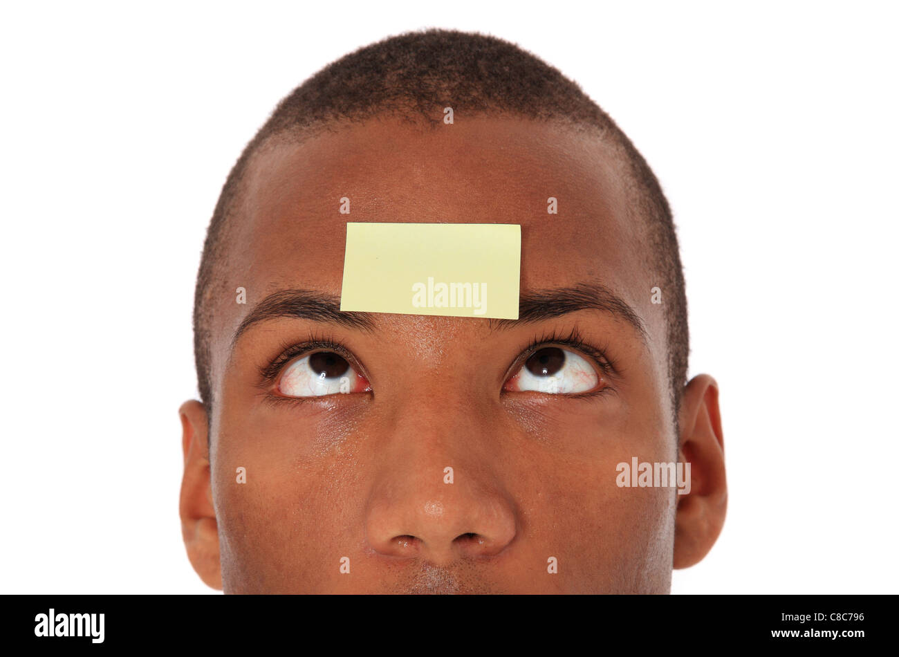 Attractive black with blank post-it note on his forehead. All on white ...
