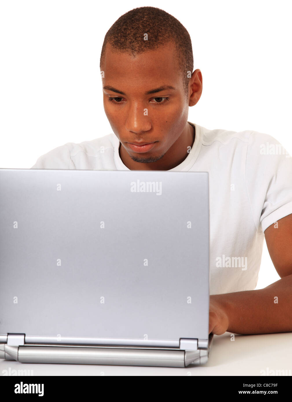 Attractive black guy using laptop. All on white background Stock Photo ...