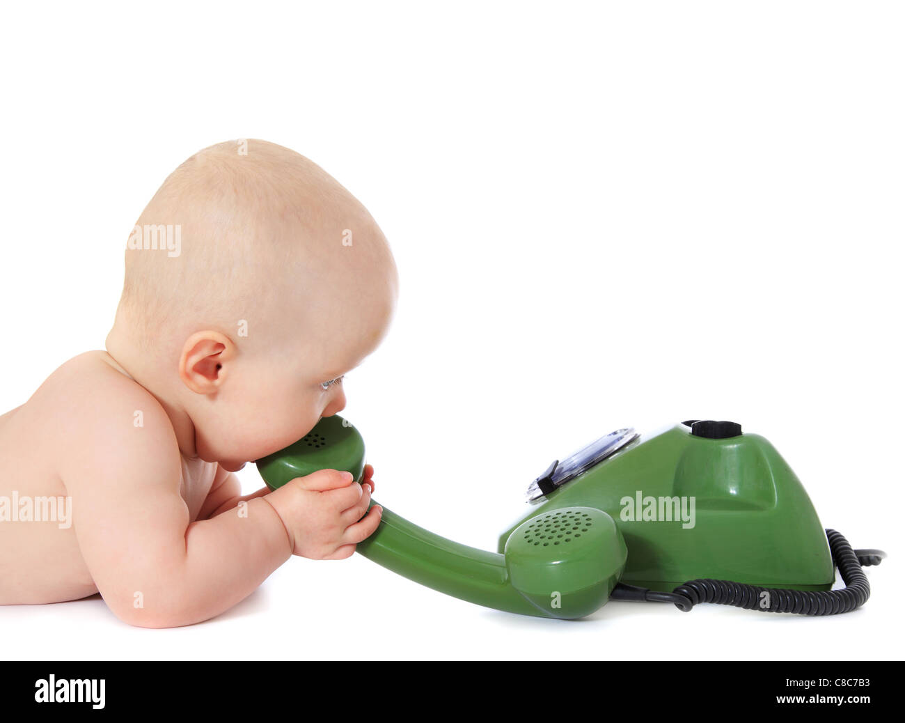 Cute little baby playing with telephone. All on white background Stock ...