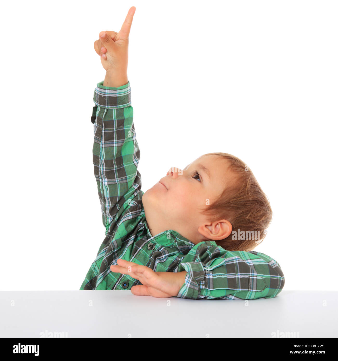 Cute caucasian boy points with finger. All on white background Stock ...