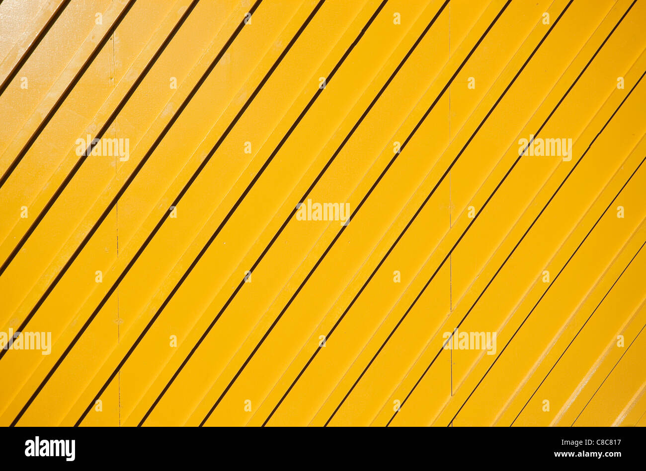 Yellow board with diagonal lines Stock Photo - Alamy