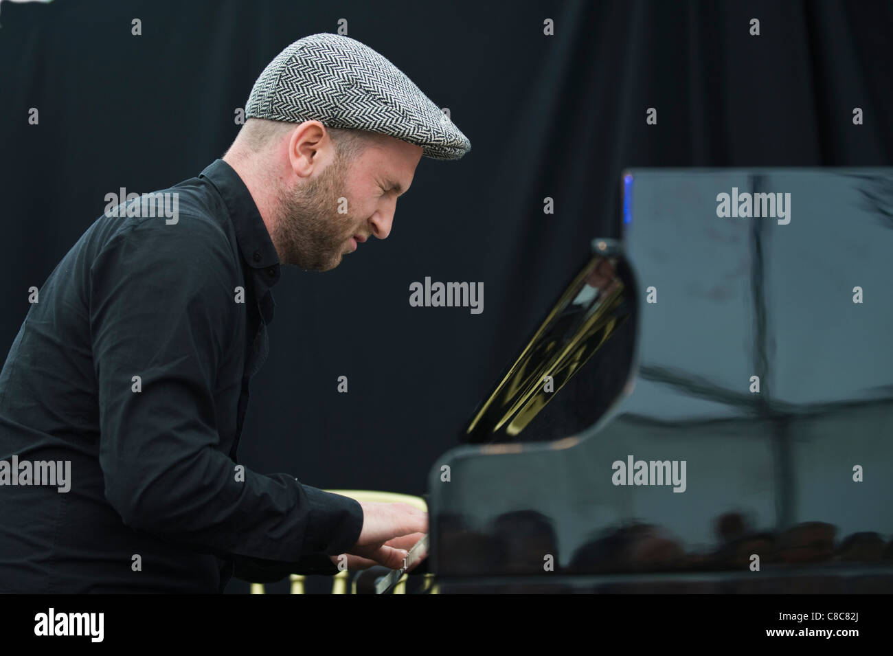Pianist Sam Crowe playing on stage with his band The Sam Crowe Group at ...