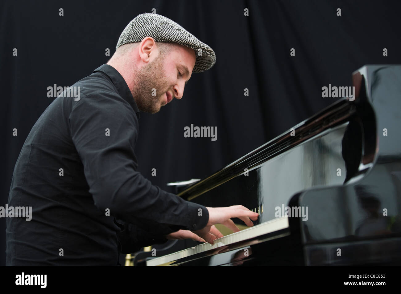 Pianist Sam Crowe playing on stage with his band The Sam Crowe Group at ...