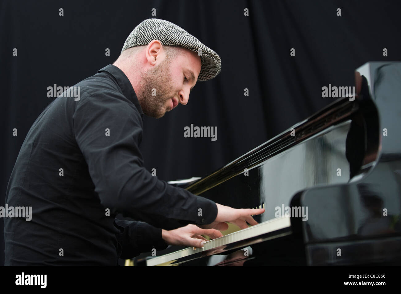 Pianist Sam Crowe playing on stage with his band The Sam Crowe Group at ...