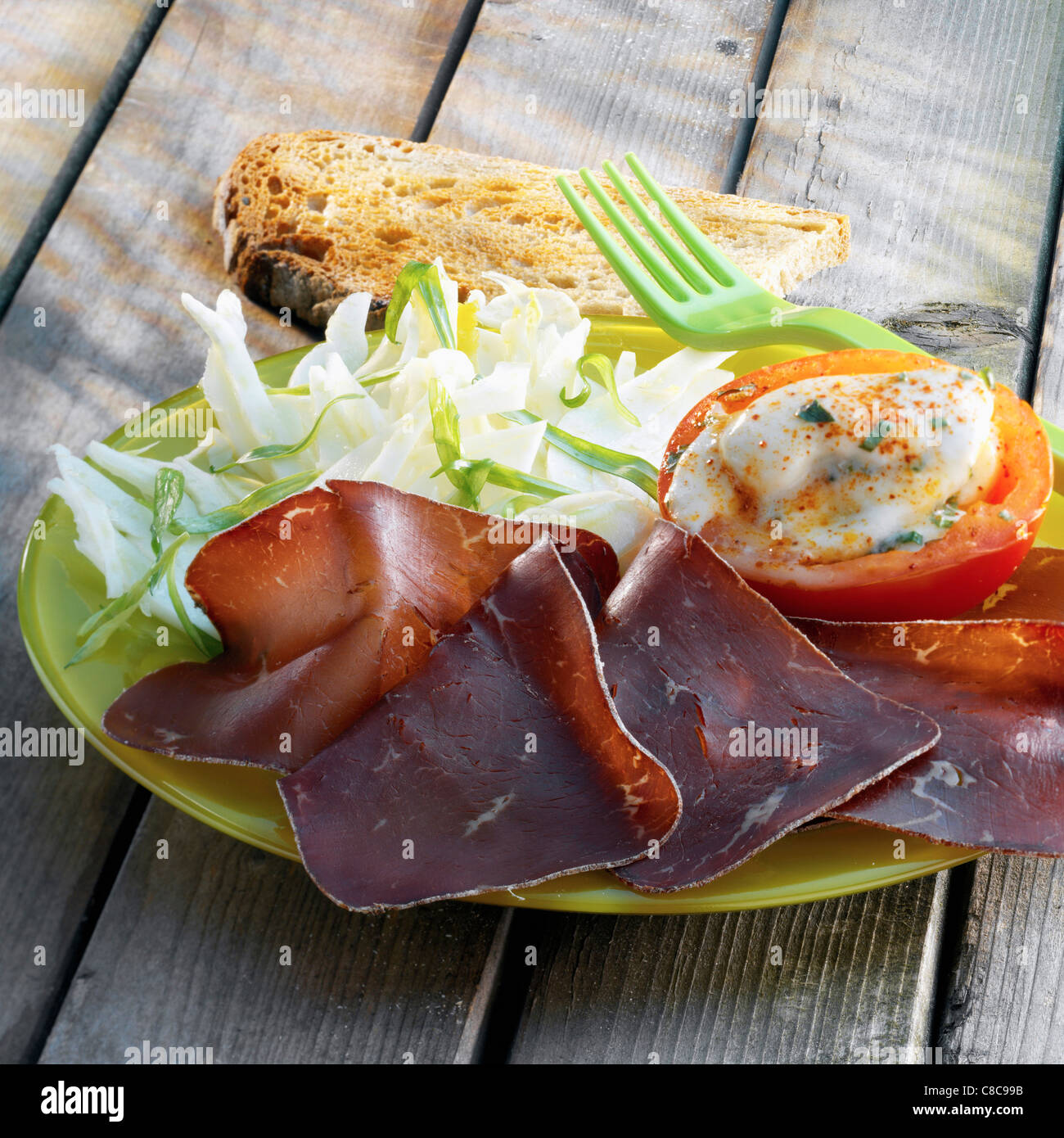 Grisons meat and tomato salad Stock Photo - Alamy