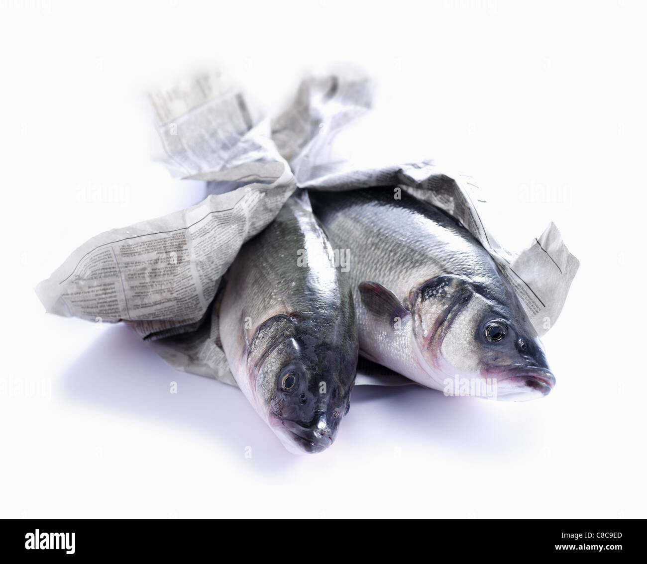 Fish wrapped in newspaper hi-res stock photography and images - Alamy