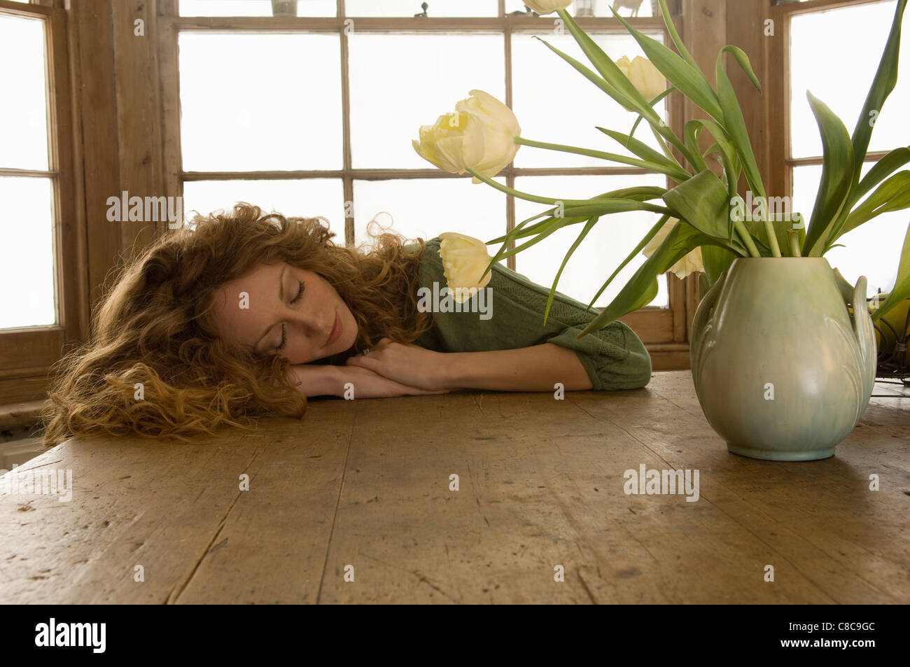 Woman laying on kitchen hi-res stock photography and images - Alamy