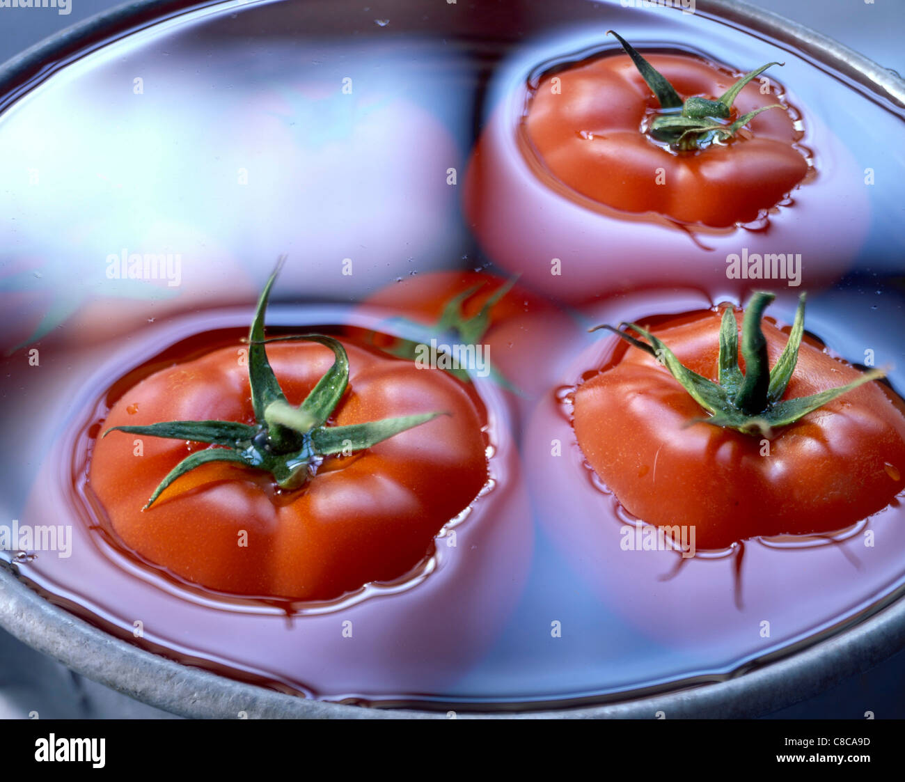 tomatoes in water Stock Photo - Alamy