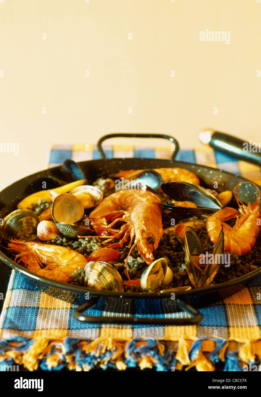 Paella with wild rice Stock Photo - Alamy