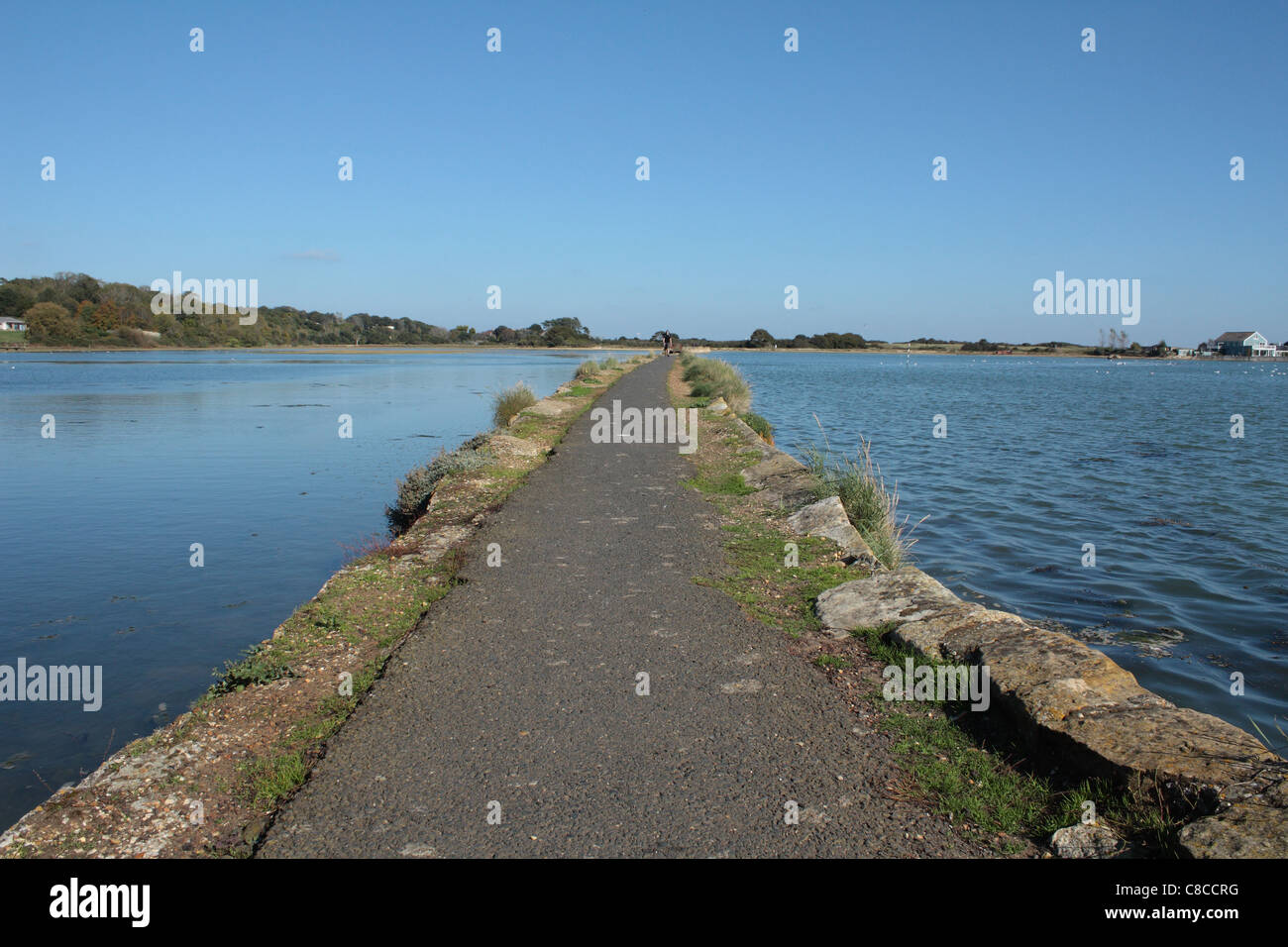 Causeway across Bembridge Harbour with the Old Mill Ponds to the left ...