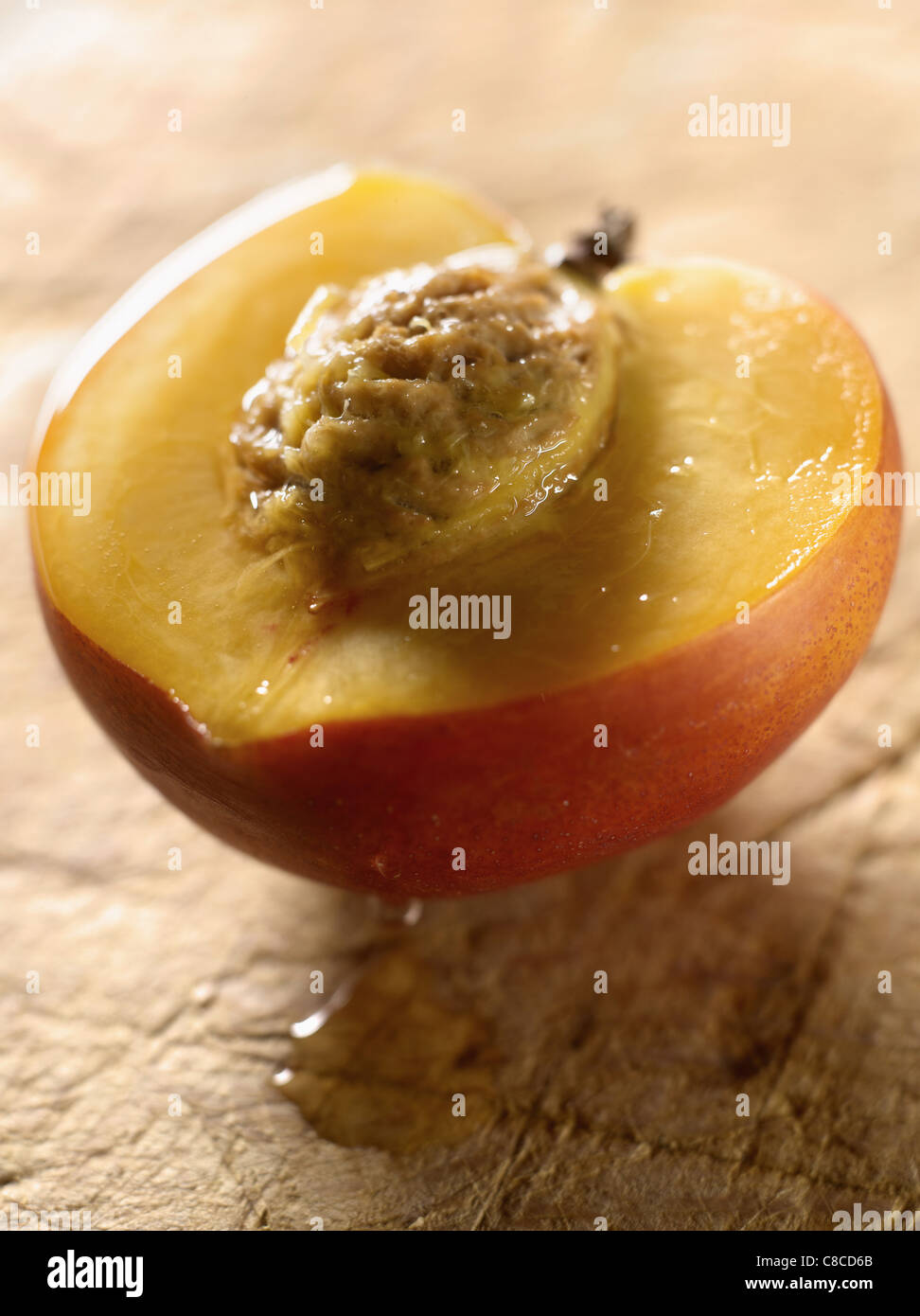 half a nectarine with stone Stock Photo - Alamy