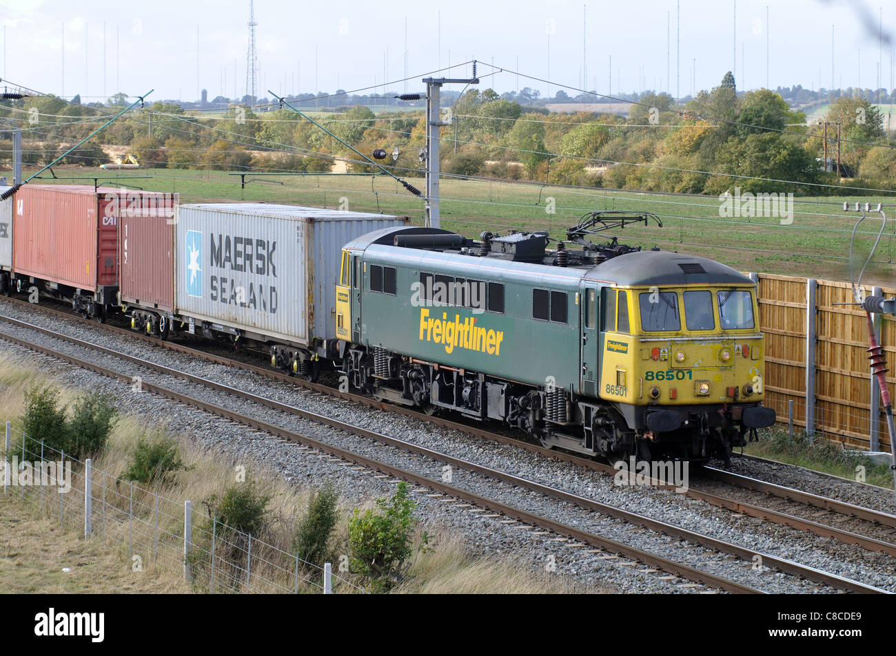 Freightliner train pulled by electric locomotive Stock Photo - Alamy