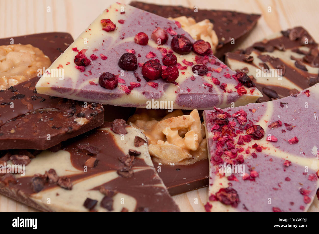 Different Kinds of Broken Chocolate Bars on Wooden Background Stock ...