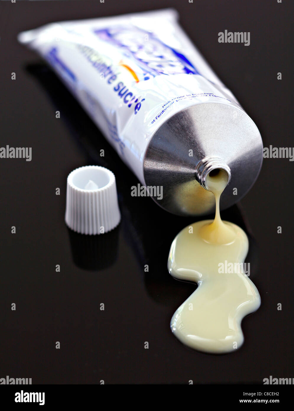 Tube of sweet concentrated milk Stock Photo - Alamy