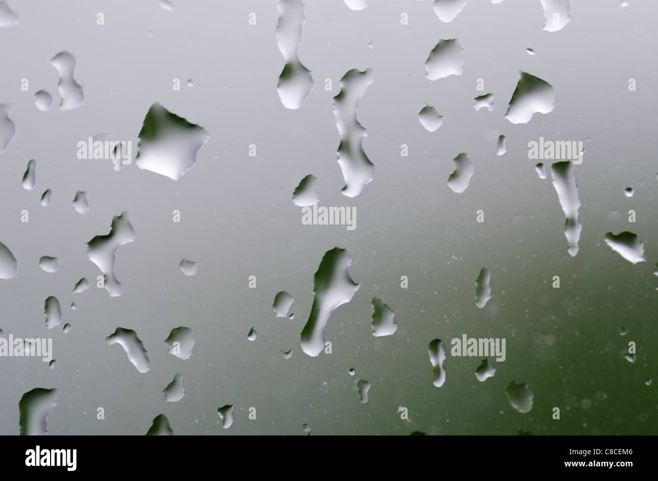 Closeup of water drops on a window when it is raining outside Stock ...