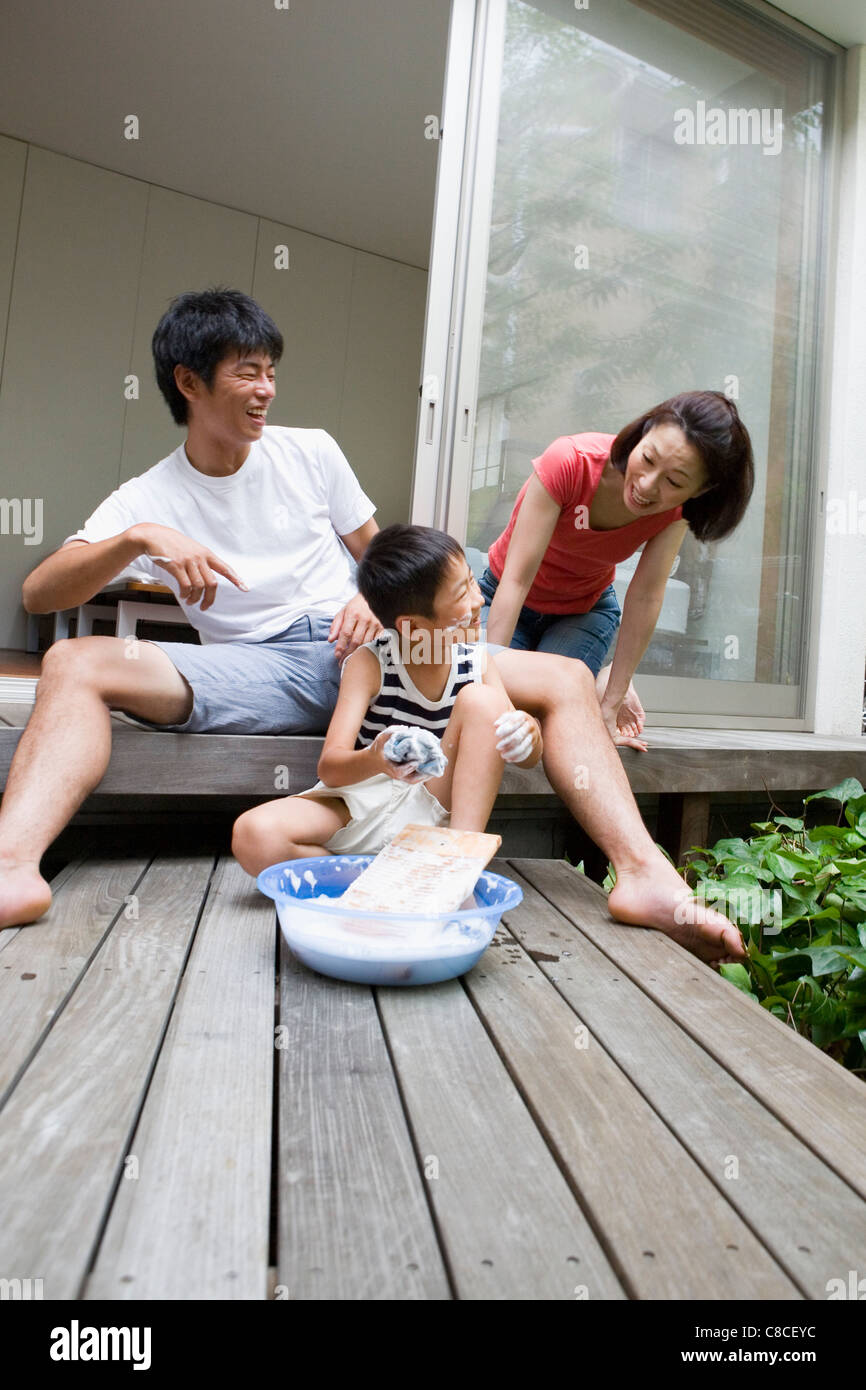 Boy washing socks by washboard Stock Photo - Alamy