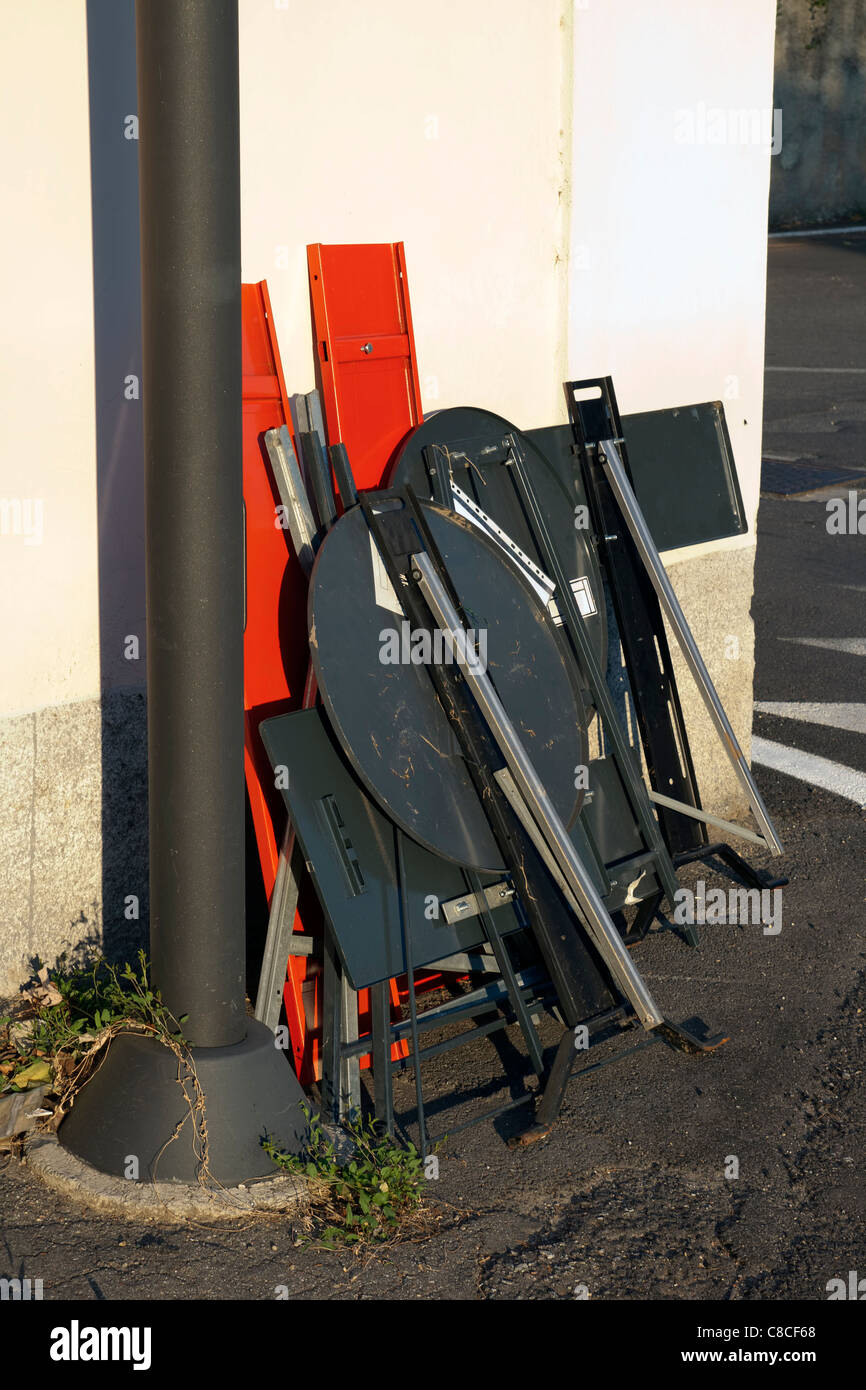 pile of traffic signs leaning against a wall Stock Photo - Alamy