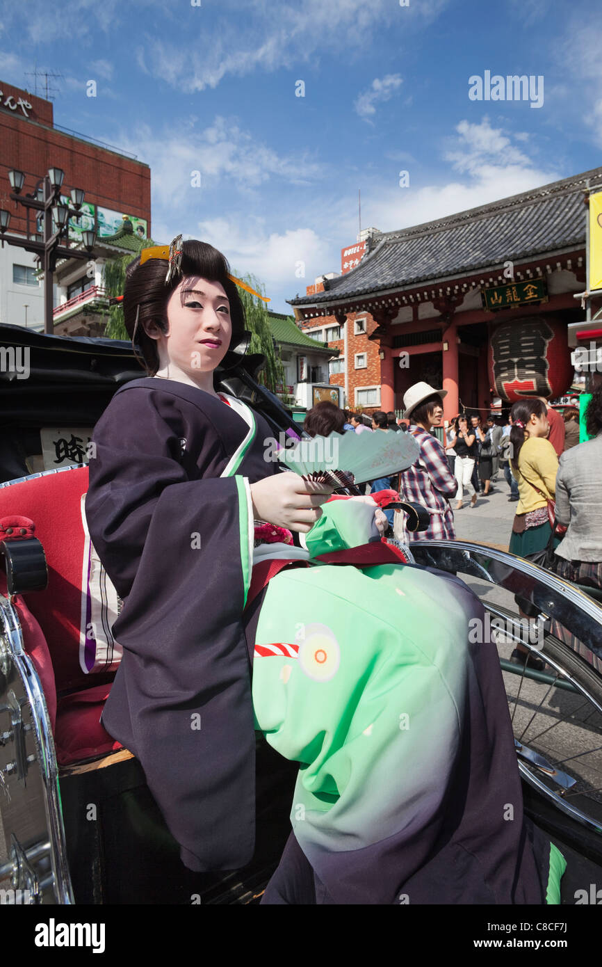 Japan, Tokyo, Asakusa, Geisha in Rickshaw in front of Asakusa Kannon ...
