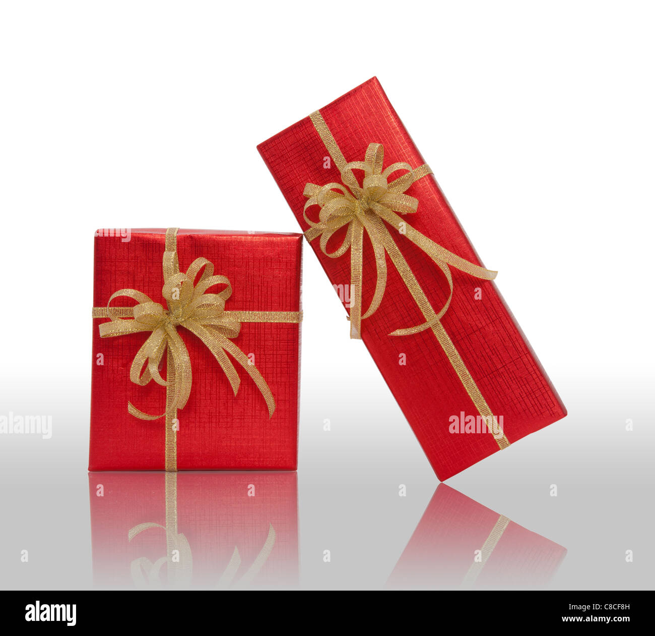 Two red gift boxes over white background Stock Photo - Alamy